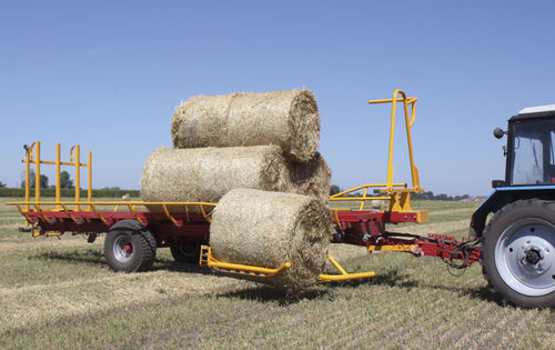 Round bale loader - PT-18 - Zavod Kobzarenka Ltd. - towed / self-unloading